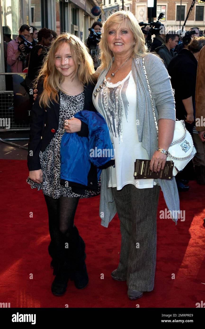 Sarah Nolan (R) and guest pose for photographers on the red carpet at ...