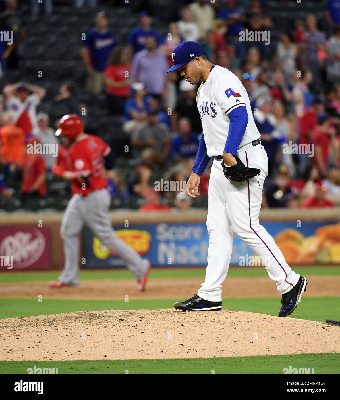 Texas Rangers relief pitcher Ricky Rodriguez walks back on the mound ...
