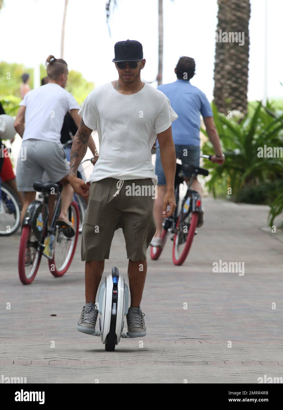 Lewis Hamilton spotted out and about with his dog while riding an ...