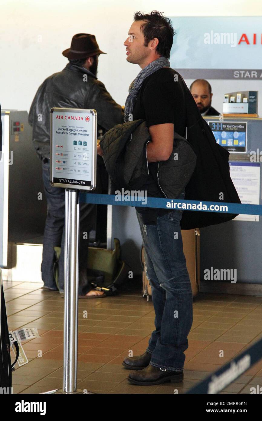 EXCLUSIVE!! The Last Song actor, Liam Hemsworth, checks in at LAX for a ...