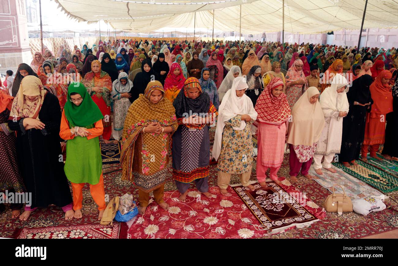 Pakistani Muslims offer prayers on the first day of Eid al-Adha, or ...