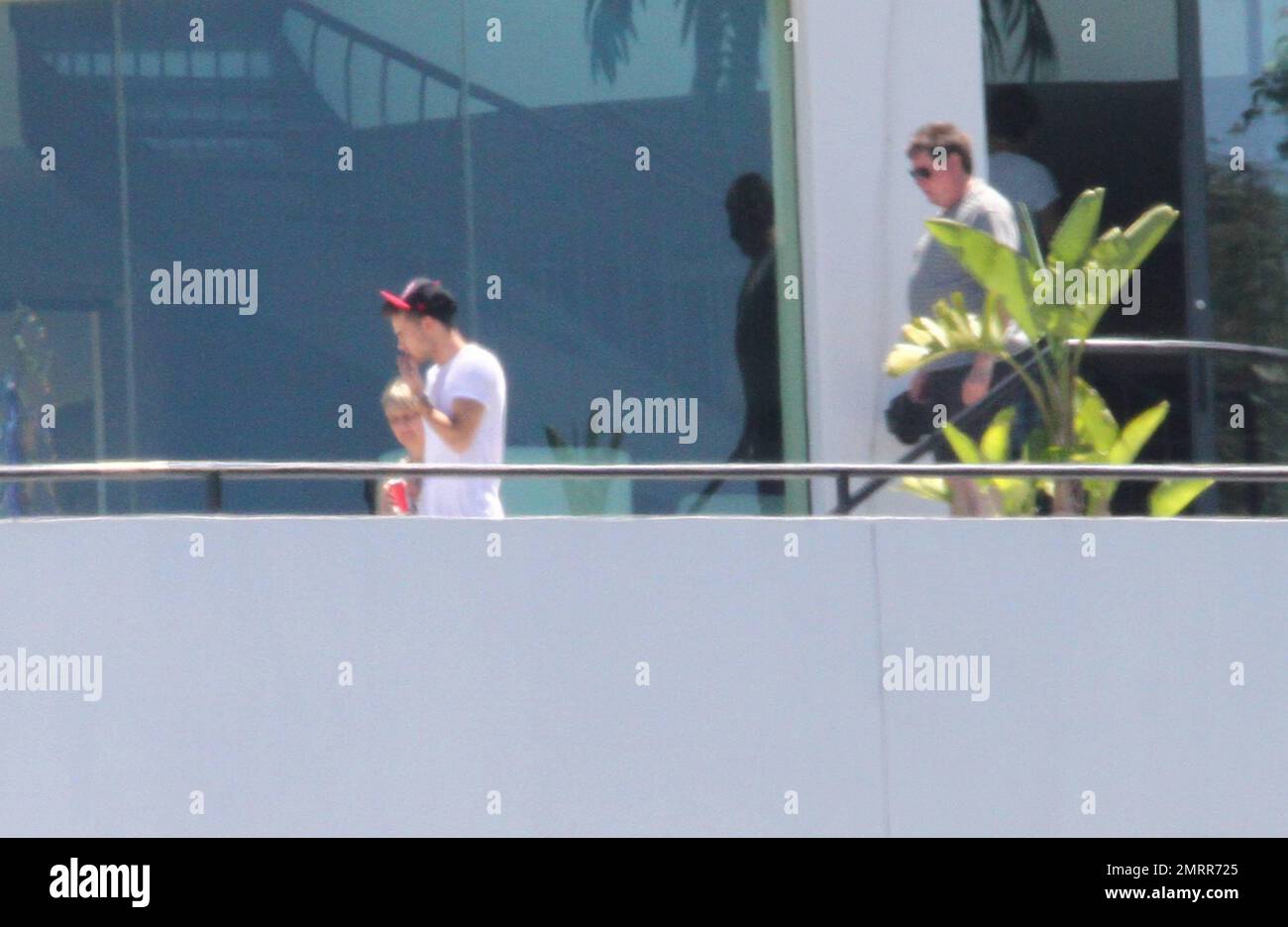 EXCLUSIVE!! One Direction boy band singer Liam Payne is joined by his ...