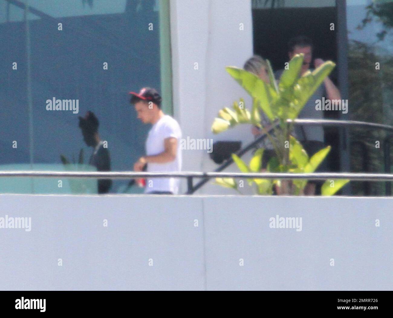 EXCLUSIVE!! One Direction boy band singer Liam Payne is joined by his ...