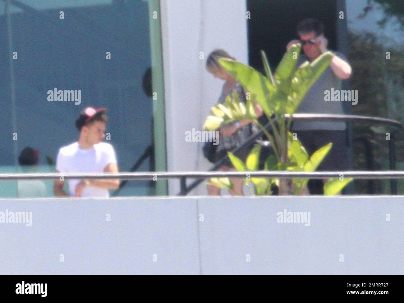 EXCLUSIVE!! One Direction boy band singer Liam Payne is joined by his ...