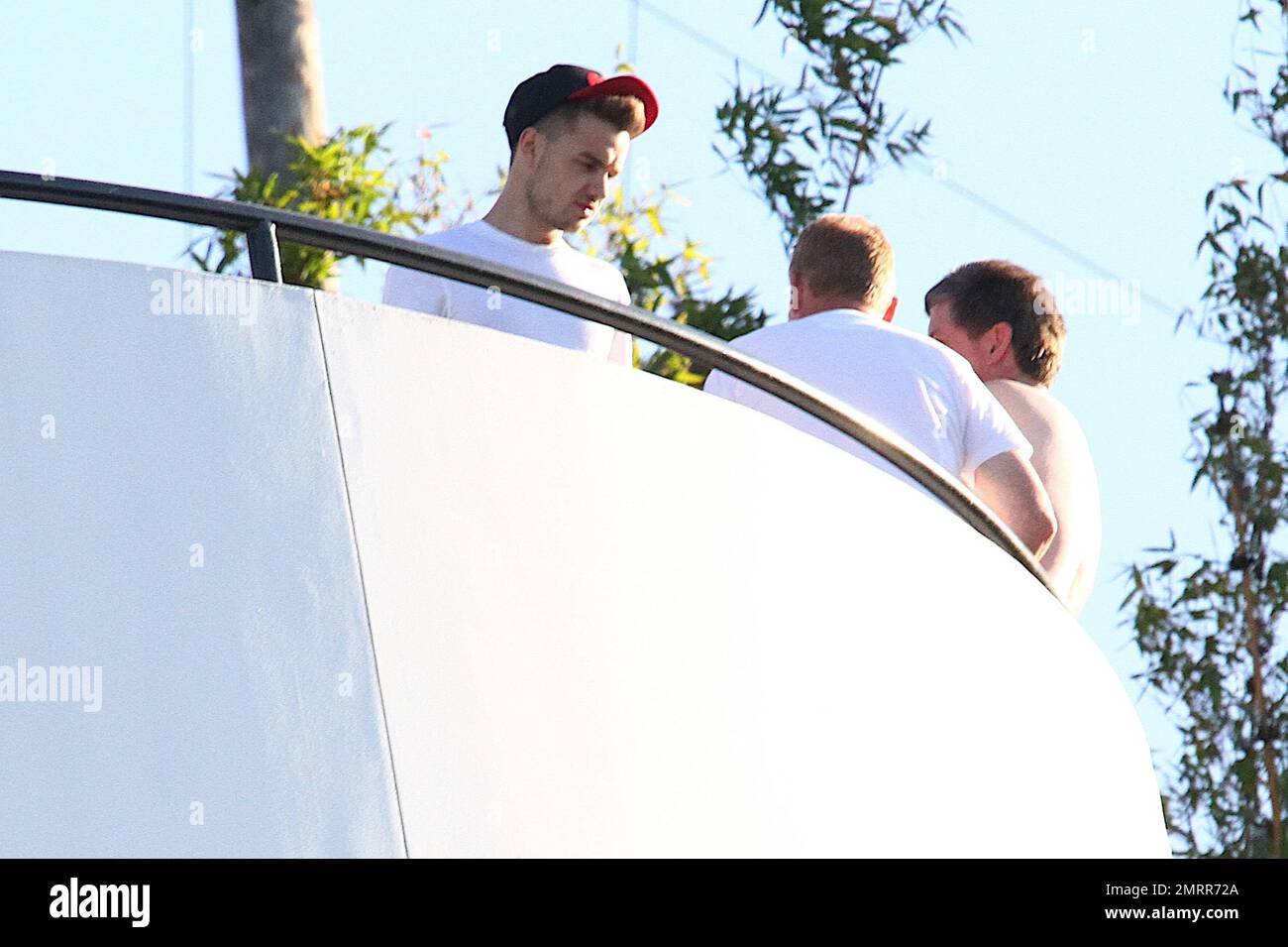 EXCLUSIVE!! One Direction boy band singer Liam Payne is joined by his ...