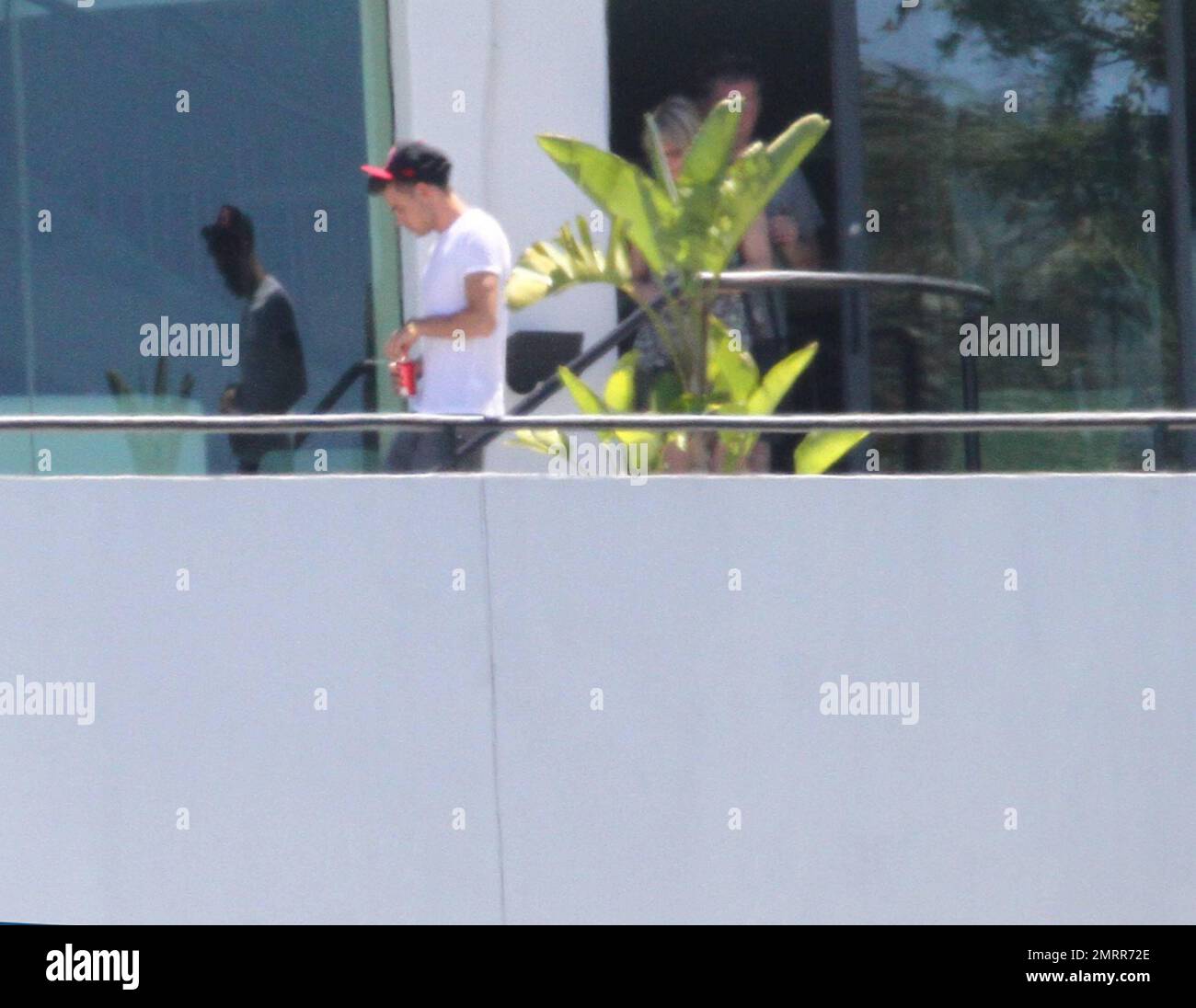 EXCLUSIVE!! One Direction boy band singer Liam Payne is joined by his ...