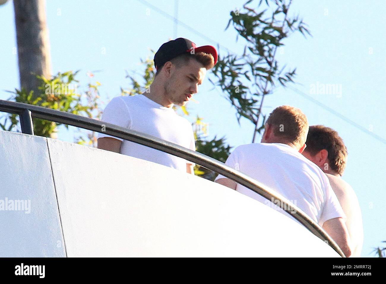 EXCLUSIVE!! One Direction boy band singer Liam Payne is joined by his ...