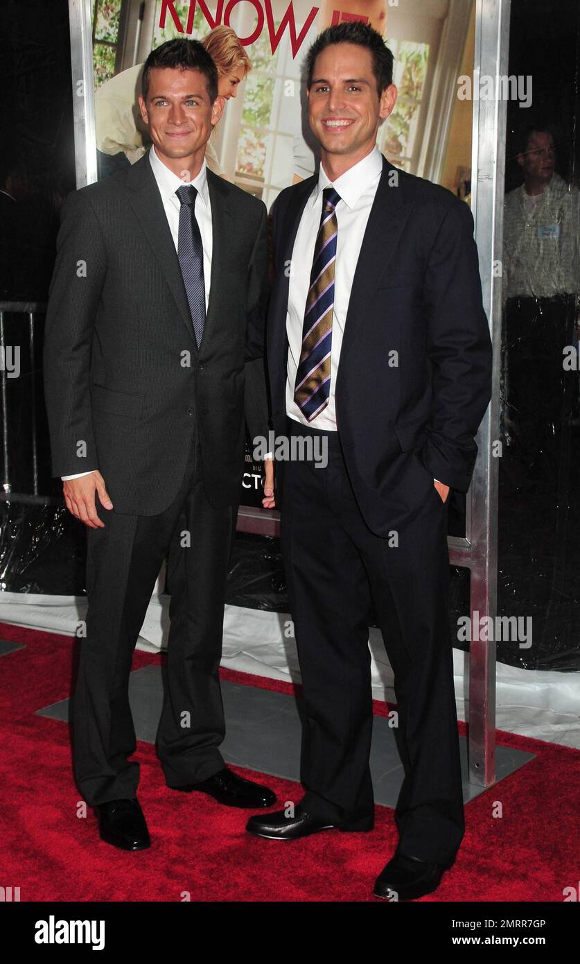 Greg Berlanti (R) and partner walk the red carpet at the premiere of ...