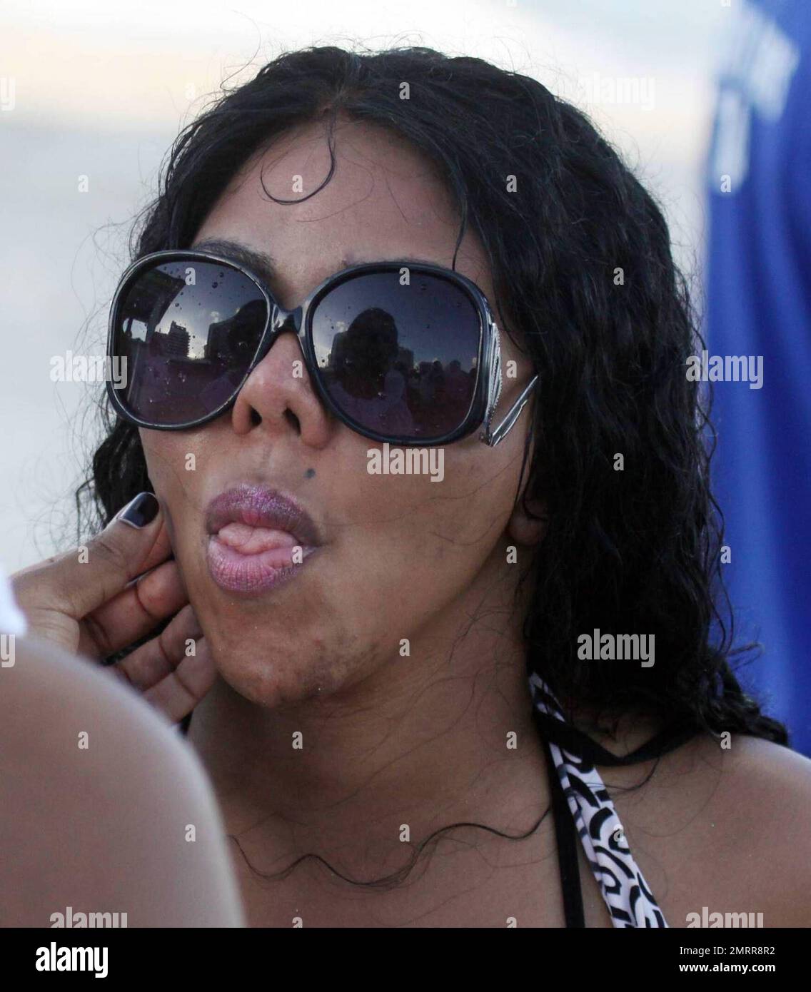 Lil' Kim and her girlfriends enjoy an afternoon at the beach playing on ...