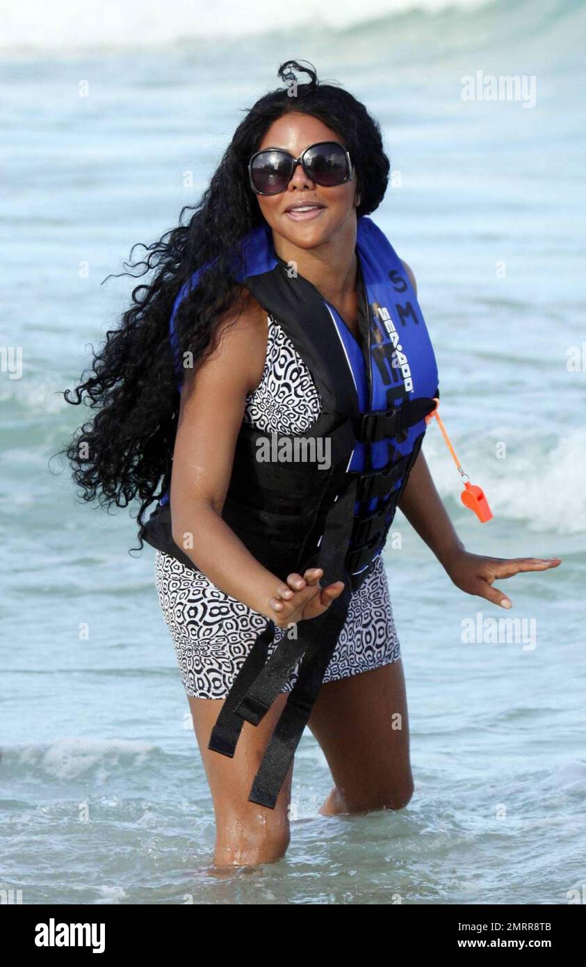 Lil' Kim and her girlfriends enjoy an afternoon at the beach playing on ...