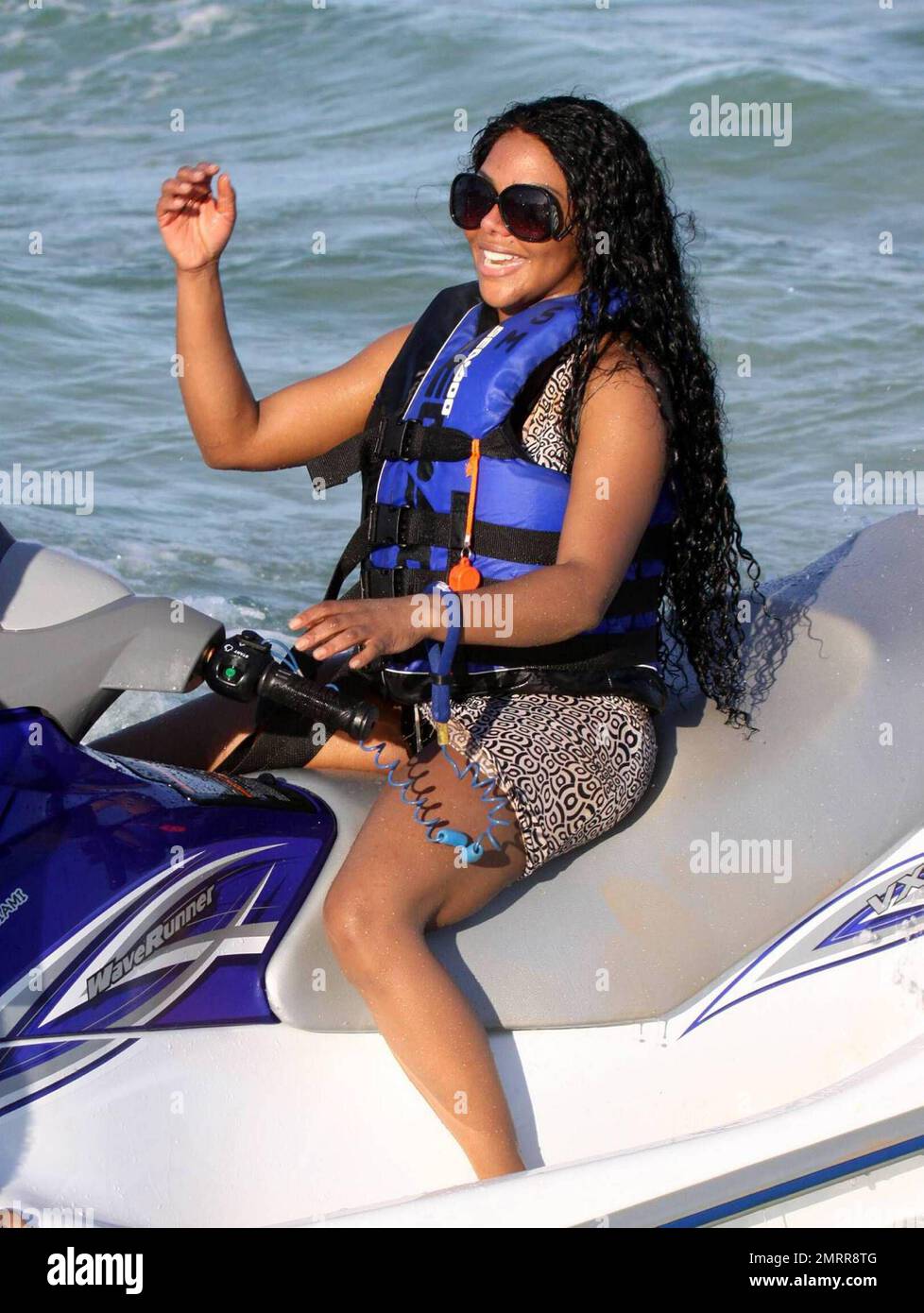 Lil' Kim and her girlfriends enjoy an afternoon at the beach playing on ...
