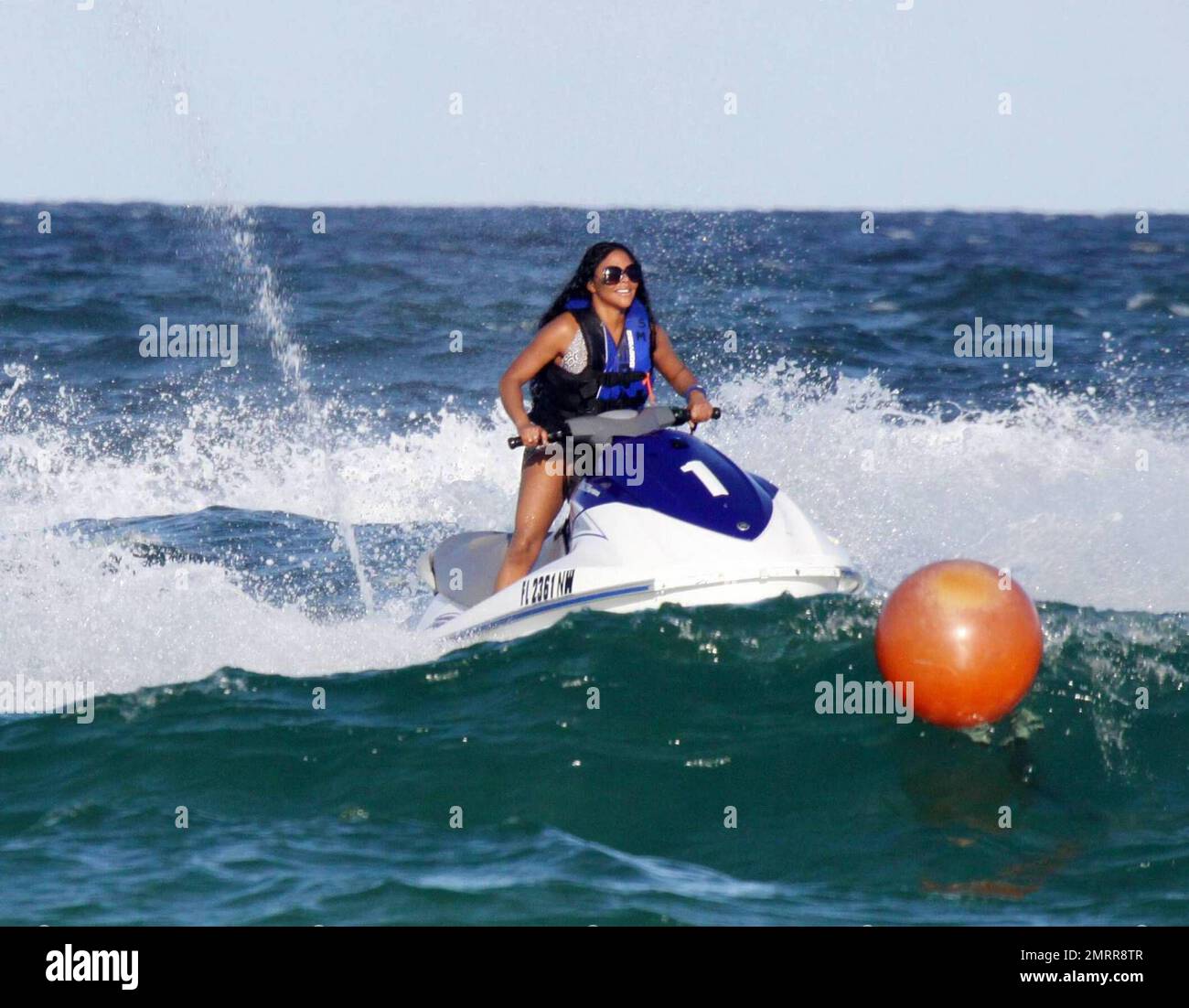 Lil' Kim and her girlfriends enjoy an afternoon at the beach playing on ...