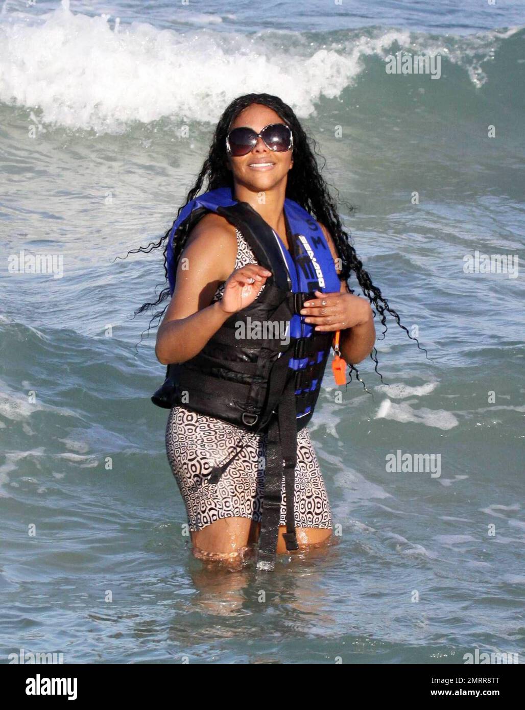 Lil' Kim and her girlfriends enjoy an afternoon at the beach playing on ...