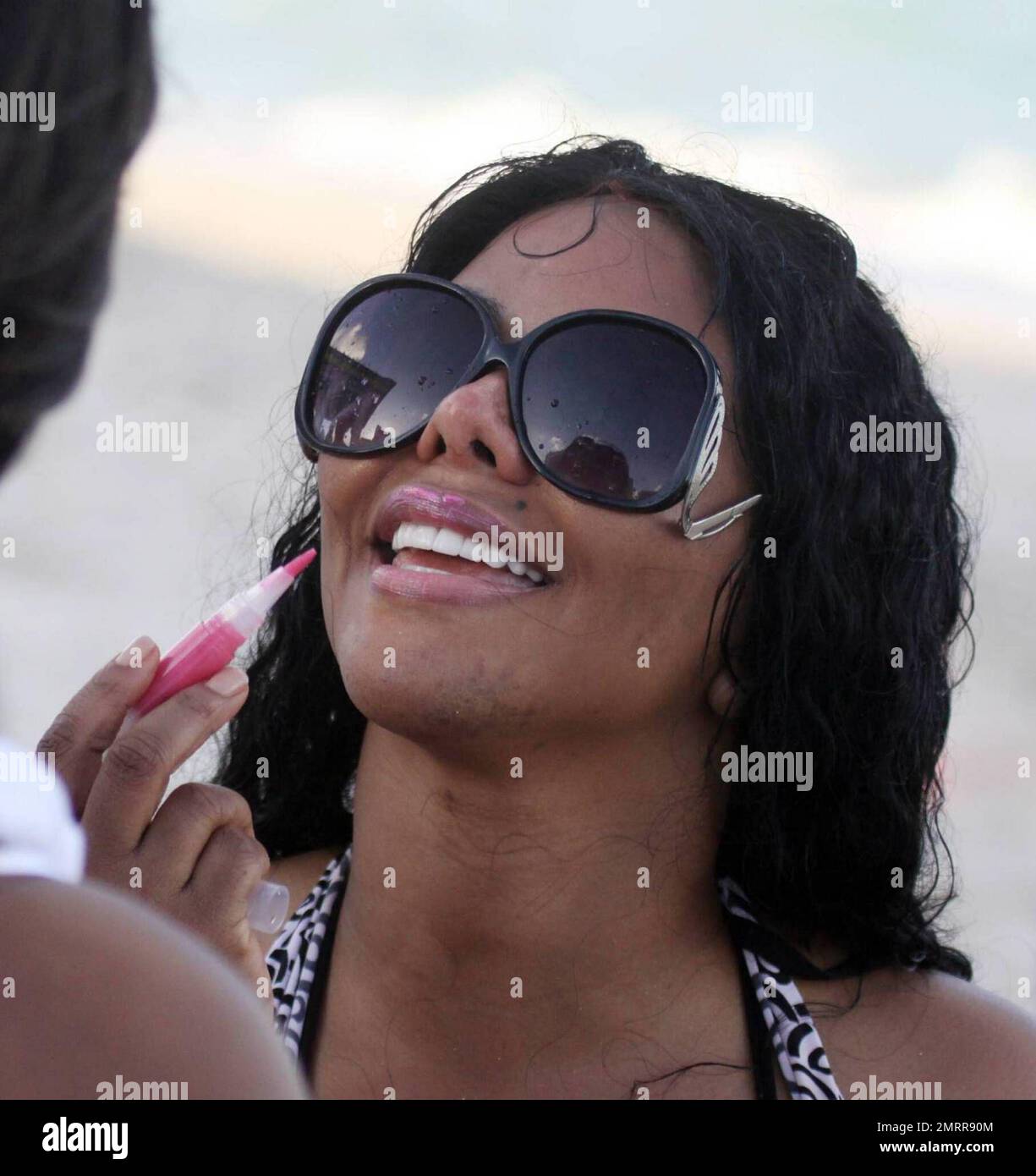 Lil' Kim and her girlfriends enjoy an afternoon at the beach playing on ...