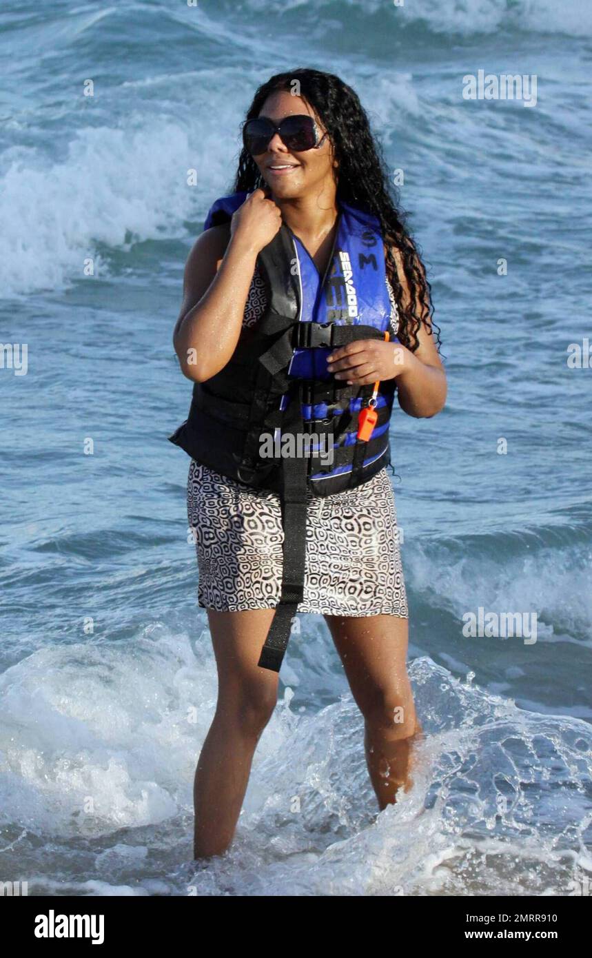 Lil' Kim and her girlfriends enjoy an afternoon at the beach playing on ...