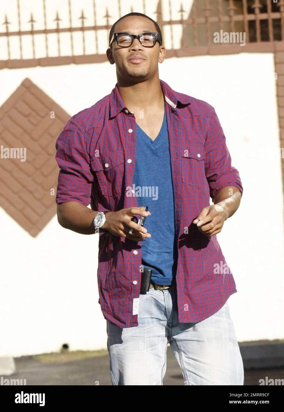 Hip hop singer Lil' Romeo (aka Romeo Miller) carries his Louis Vuitton ...