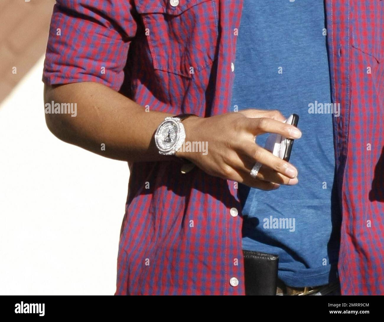 Hip hop singer Lil' Romeo (aka Romeo Miller) carries his Louis Vuitton ...