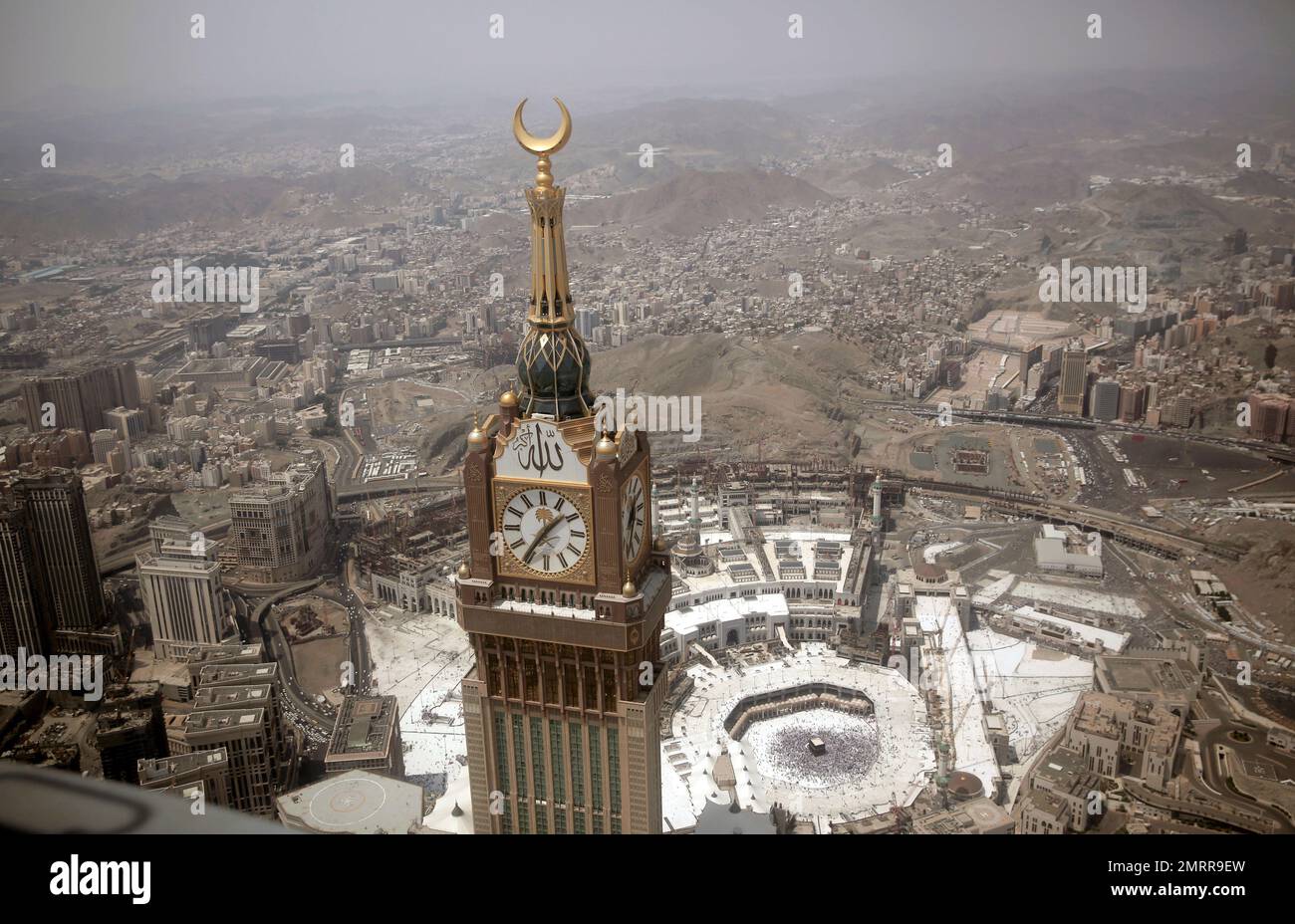 An aerial view made of the clock towers over the Grand mosque as Muslim ...