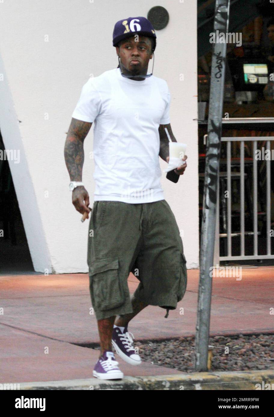 EXCLUSIVE!! Rapper and ex-convict Lil Wayne smokes a cigar and carries ...