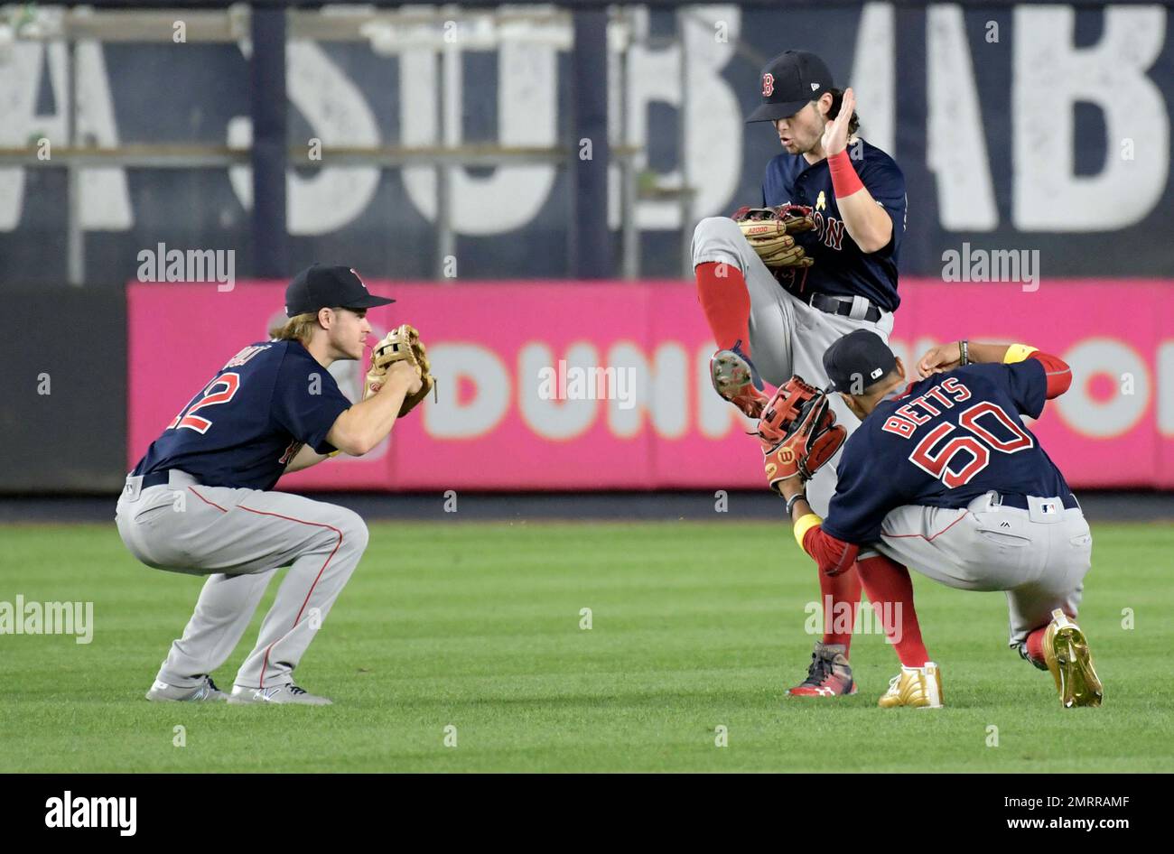 Boston Red Sox left fielder Brock Holt, left, center fielder Andrew ...