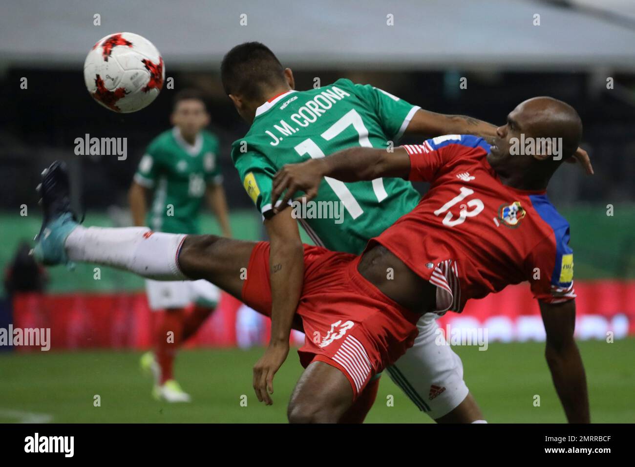 Panama's Adolfo Machado, front, and Mexico's Jesus Corona battle for ...