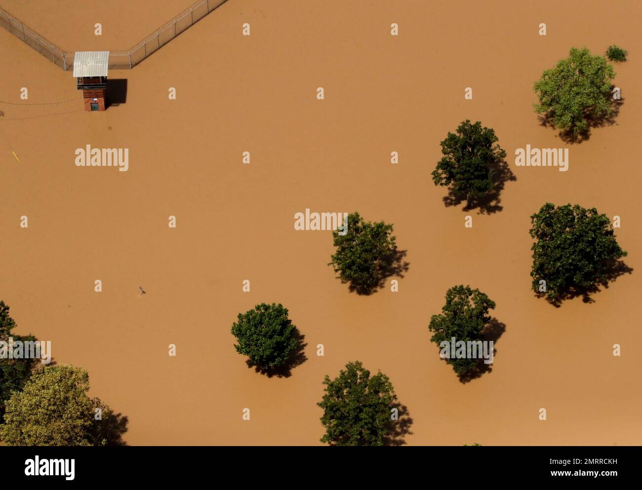The guard tower at a Texas State prison unit is submerged by water from ...
