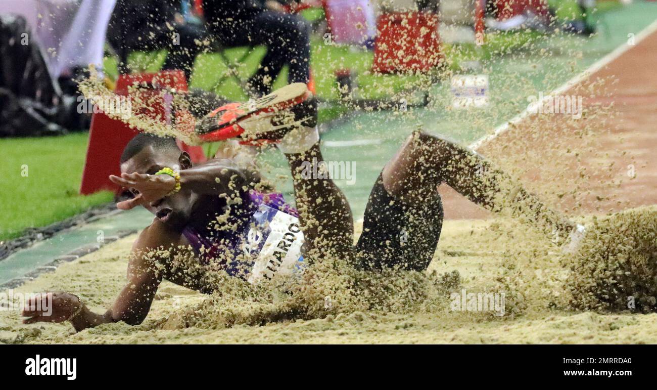 Cuba's Pedro Pablo Pichardo sits on the track after competing in the ...