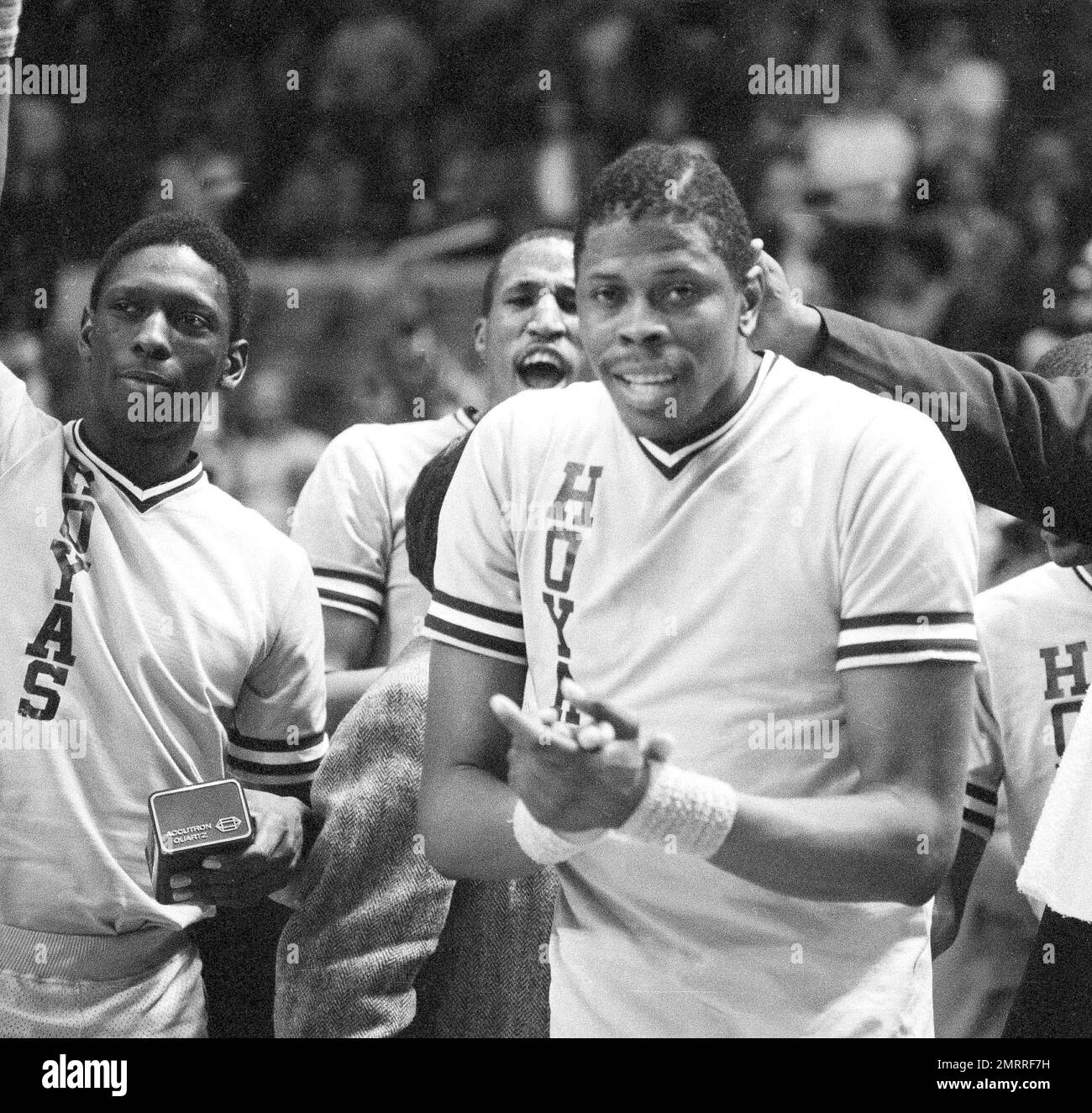 Patrick Ewing of Georgetown applauds on the sidelines during game with ...