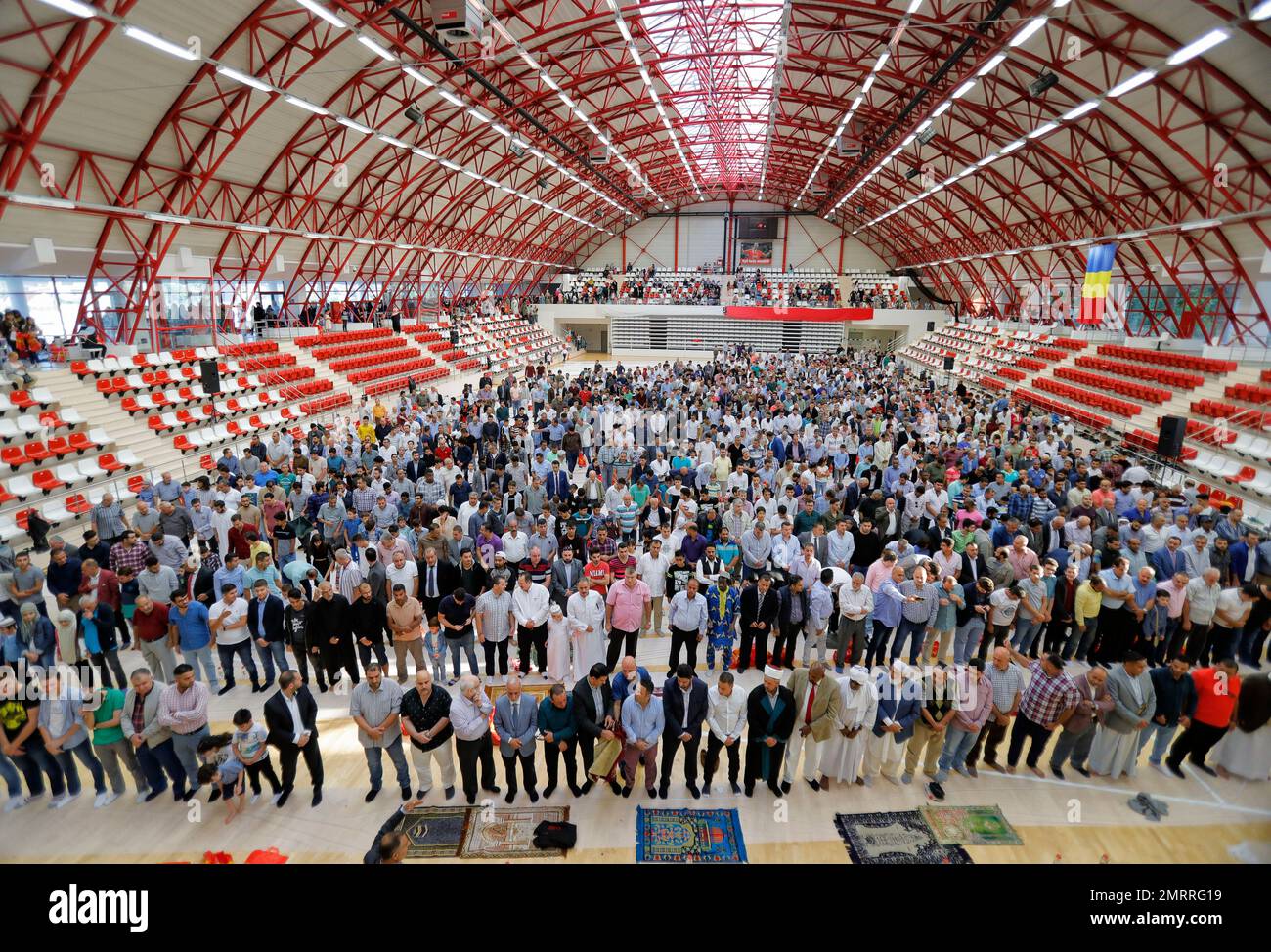 Members of Romania's muslim community stand during Eid al-Adha prayers ...
