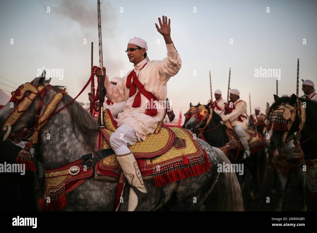 In this Thursday, Aug. 17, 2017 photo, a horseman waves to the crowd ...