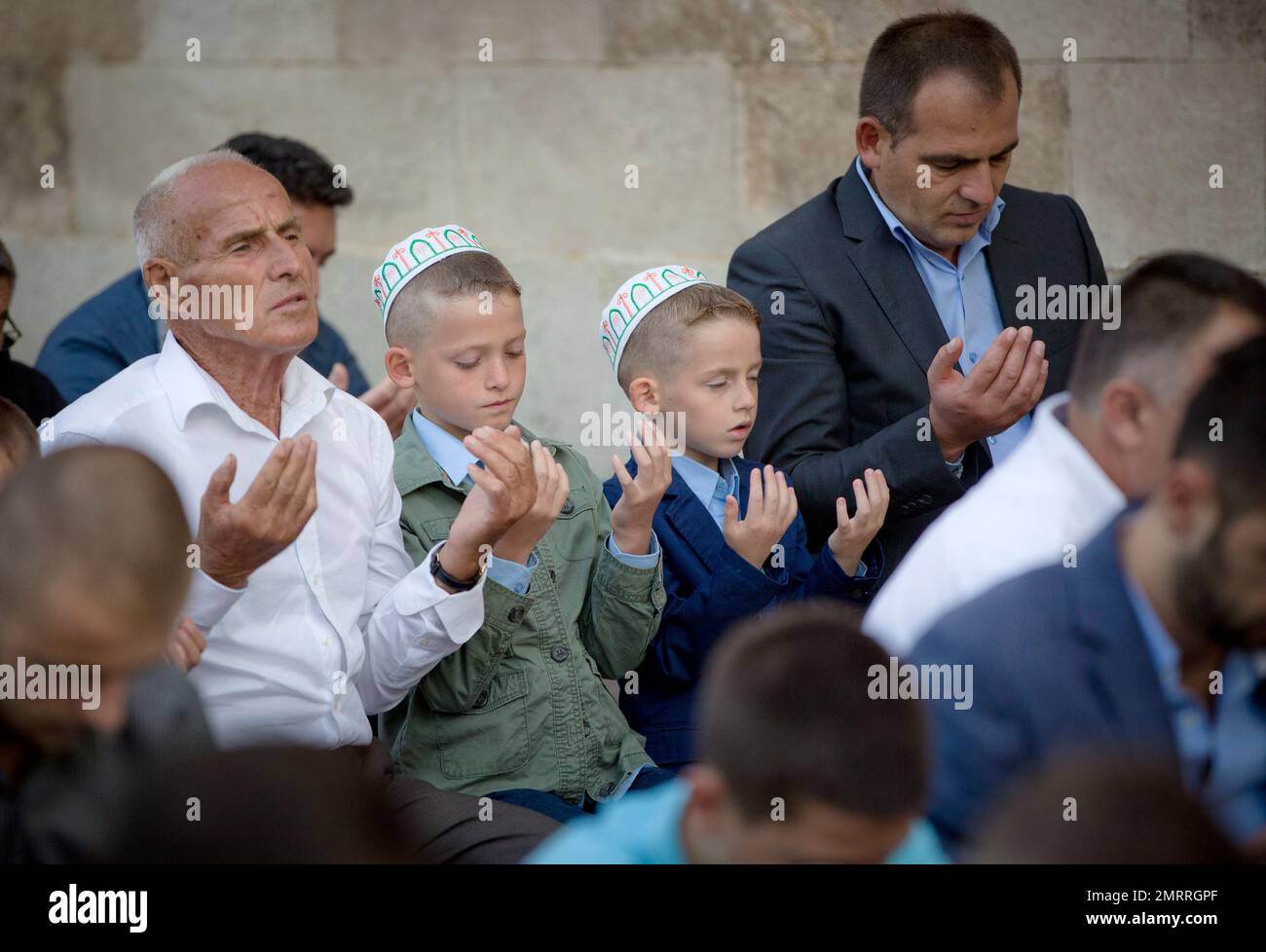 Kosovar children attend Eid al-Adha prayers outside Sultan Mehmet Fatih mosque in Pristina ...