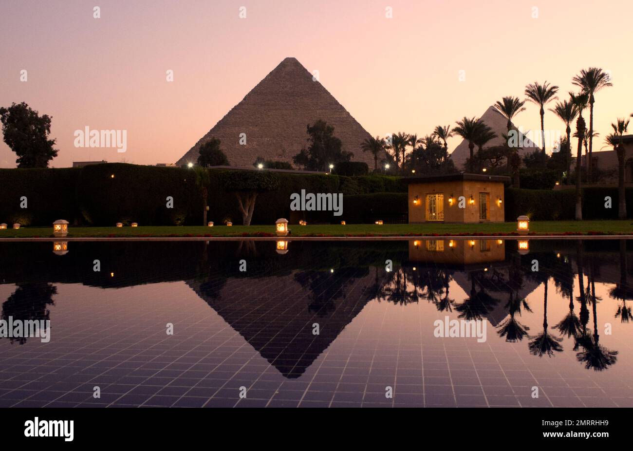 Great Pyramid of Giza at sunset with water pool reflection Stock Photo ...