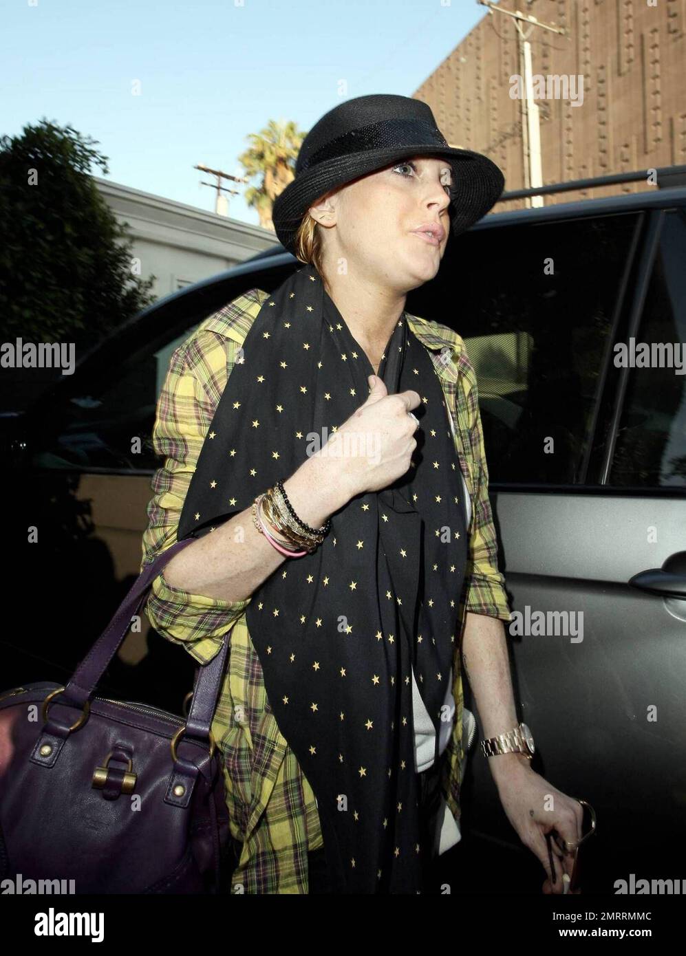 Lindsay Lohan leaves a hair salon smoking a cigarette. Los Angeles, CA ...