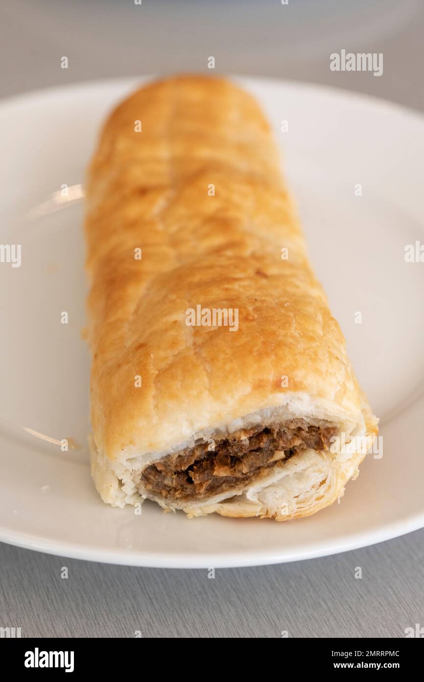 A traditional sausage roll, viewed from the end, on a plate at a South ...