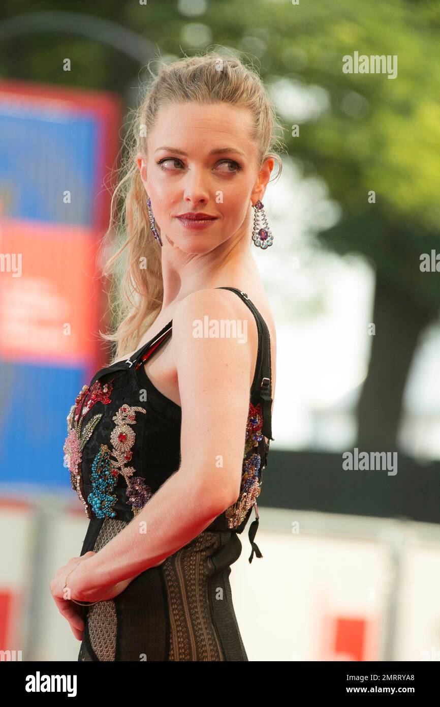 Actress Amanda Seyfried poses for photographers upon arrival at the ...