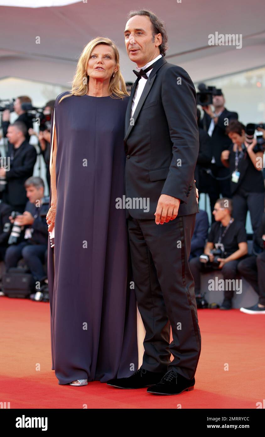 Composer Alexandre Desplat and his wife arrive on the red carpet for ...