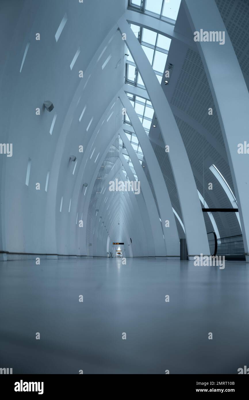 A vertical shot of modern hall with arch columns and wall cameras Stock ...