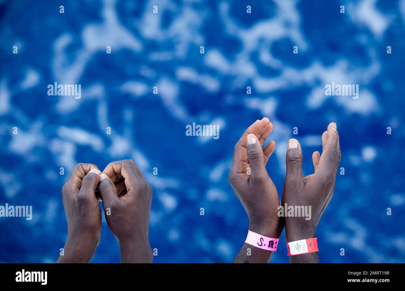 African migrants stand on the deck of the Aquarius vessel of "SOS ...