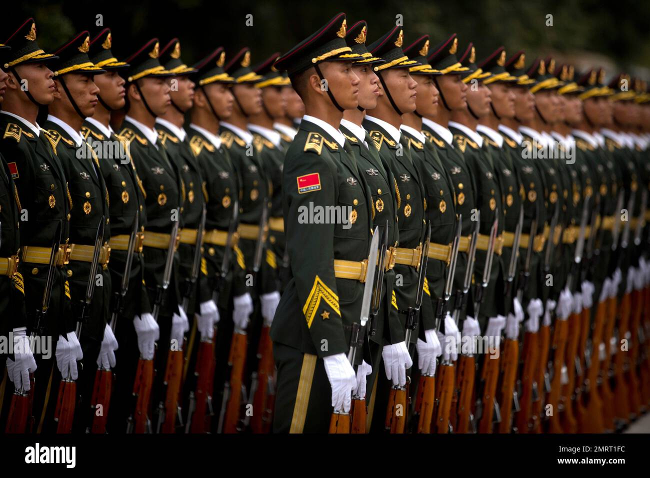 Members of a Chinese honor guard line up in formation before a welcome ...