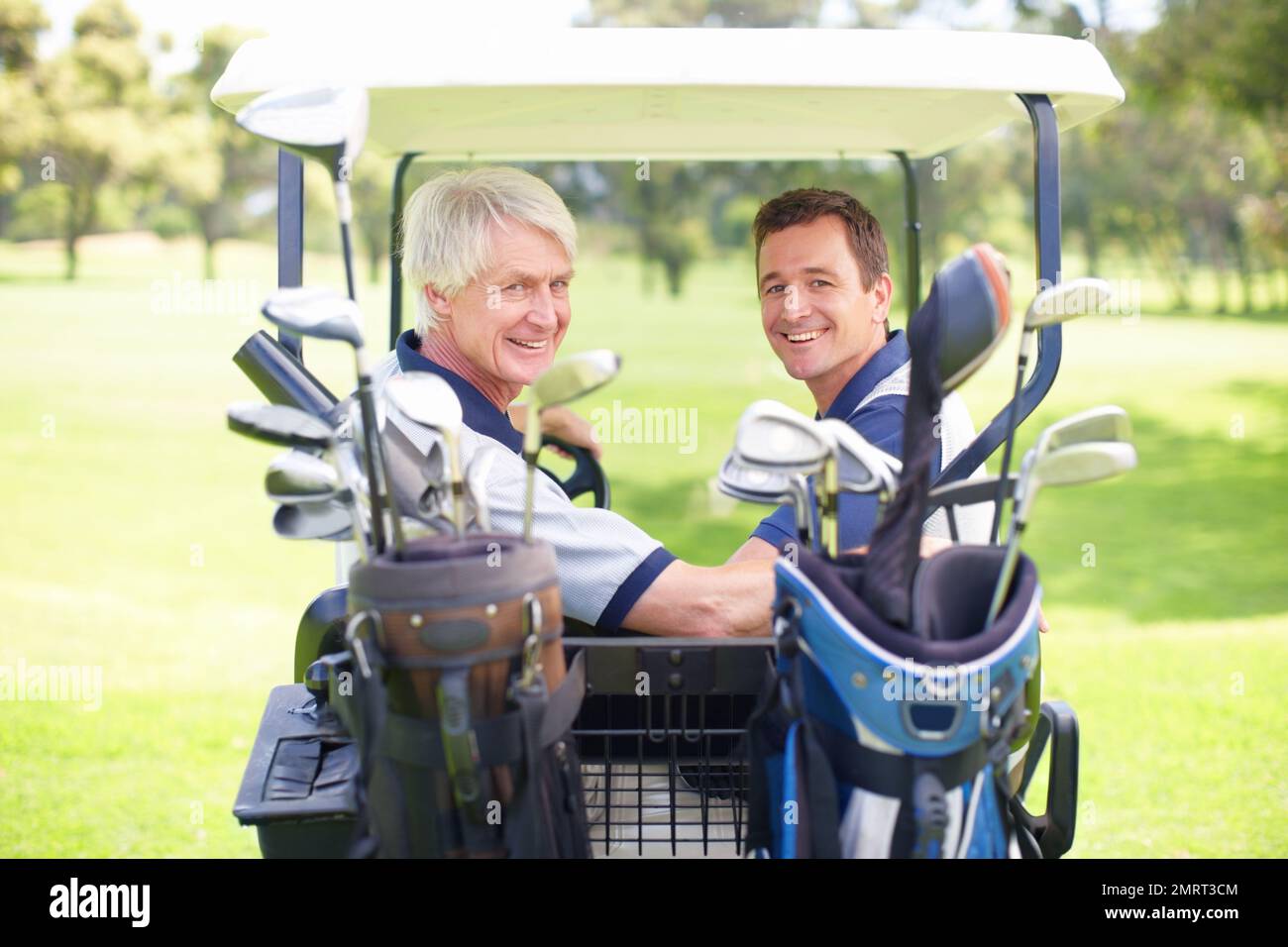 Bonding together on the golf course. Golfing companions on the golf ...
