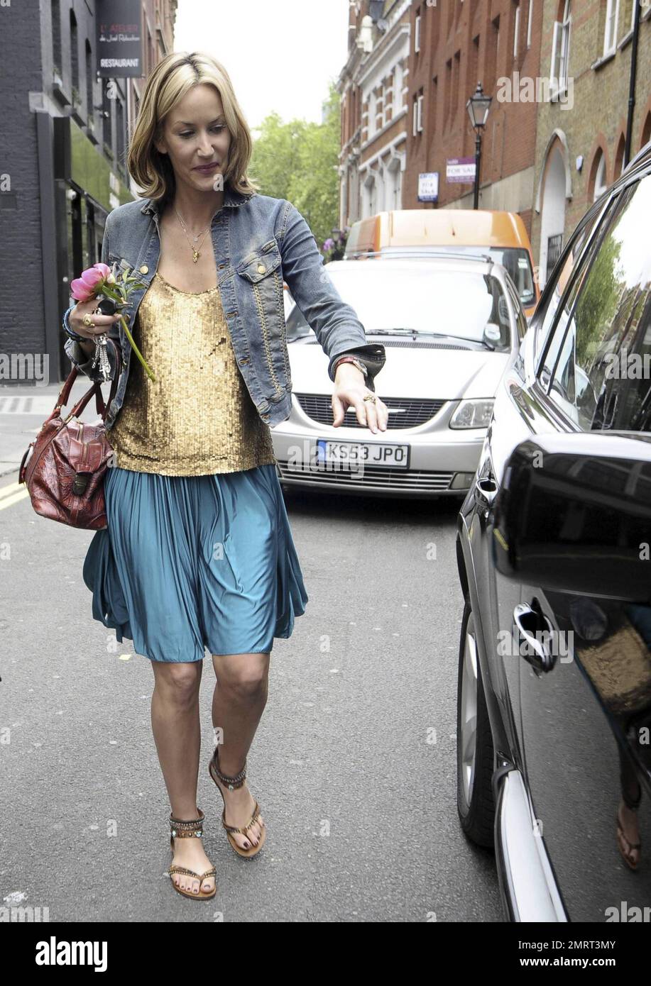 EXCLUSIVE!! '90s supermodel Lisa Butcher is all smiles as she leaves ...