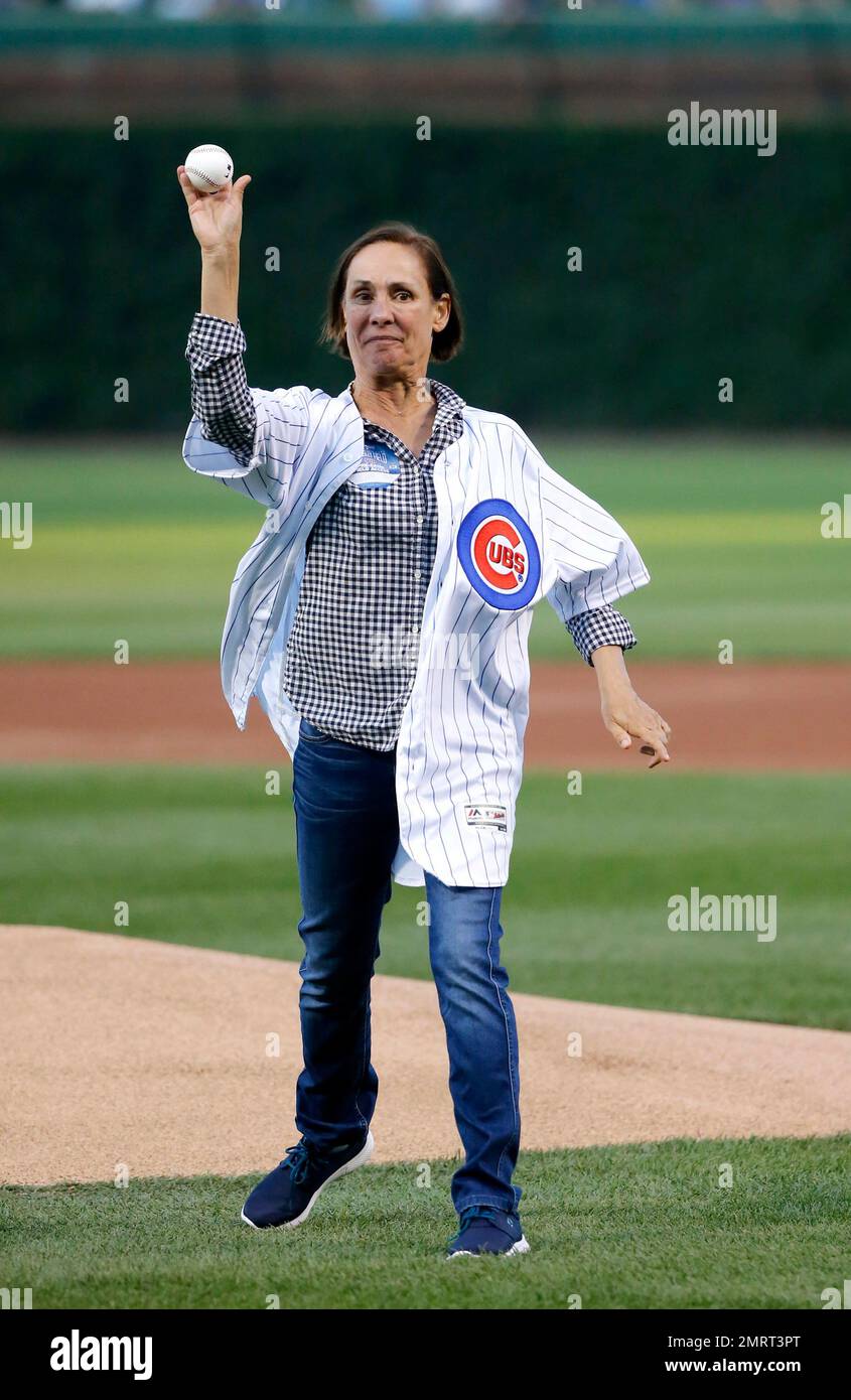 Actress Laurie Metcalf throws out a ceremonial first pitch before a baseball game between the ...