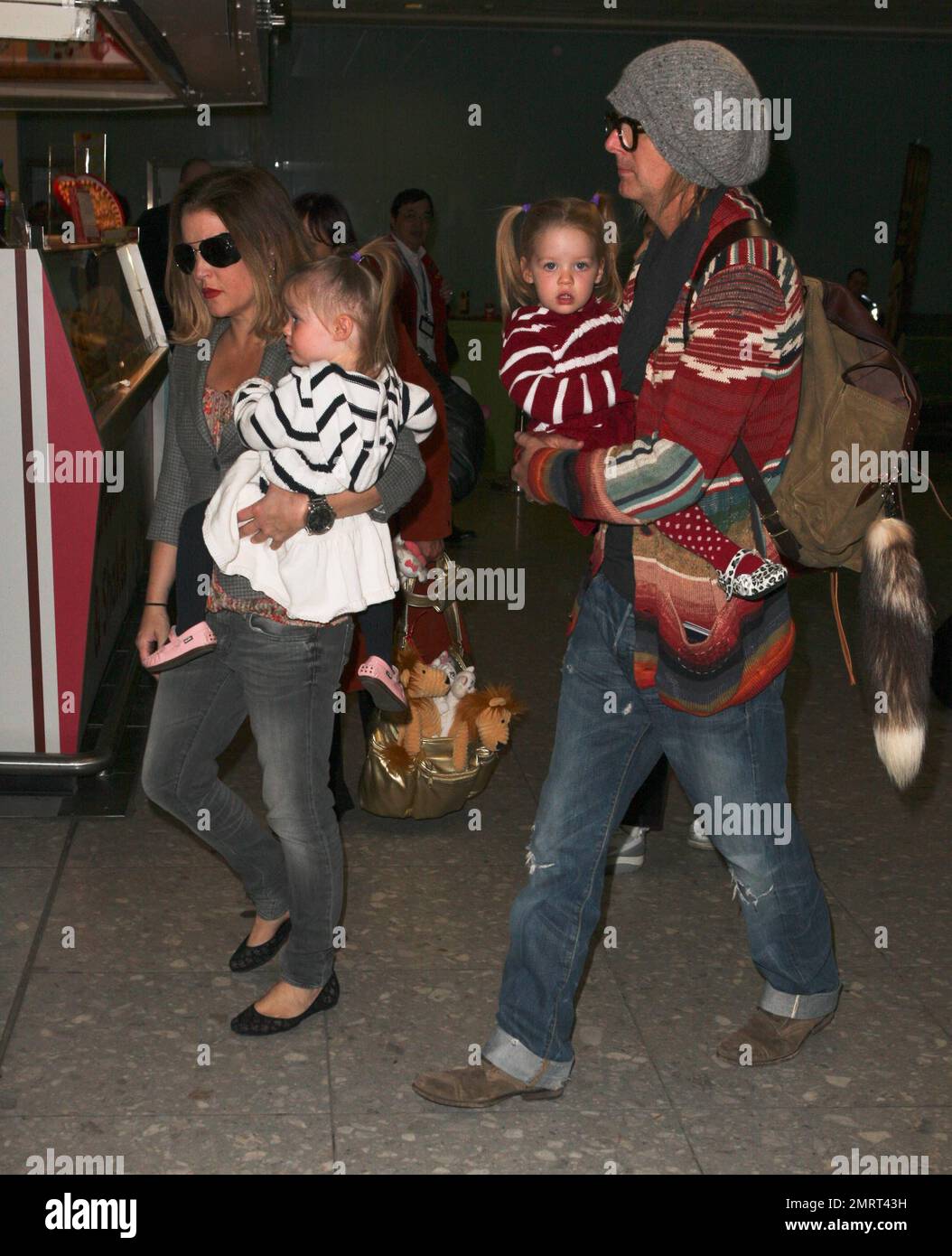 Lisa Marie Presley and husband Michael Lockwood carry their twin ...