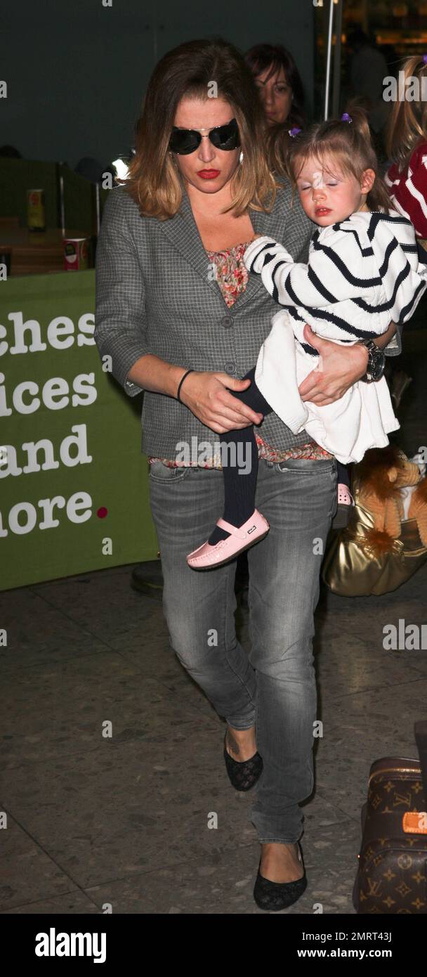 Lisa Marie Presley and husband Michael Lockwood carry their twin ...