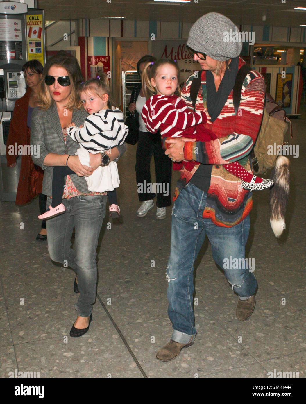 Lisa Marie Presley and husband Michael Lockwood carry their twin ...
