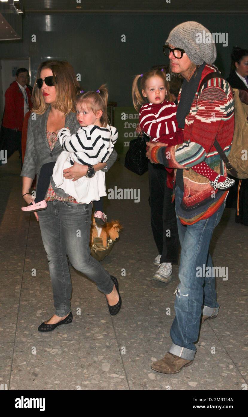Lisa Marie Presley and husband Michael Lockwood carry their twin ...