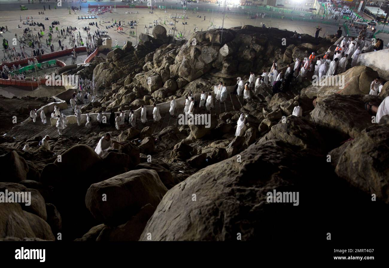 Muslim pilgrims visit the Jabal Al Rahma holy mountain, or the mountain ...