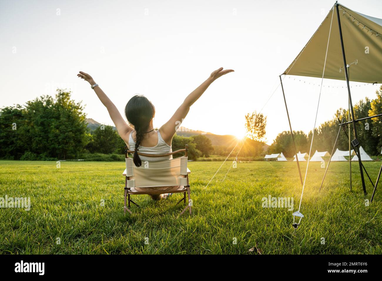 Sunshine girl sit chair Stock Photo - Alamy