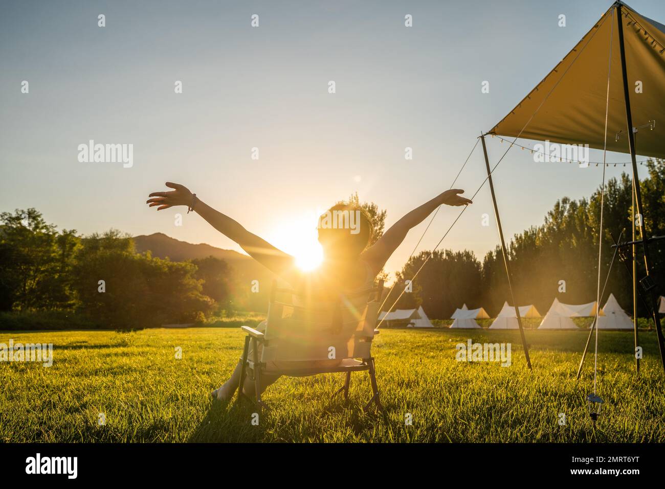 Sunshine girl sit chair Stock Photo - Alamy