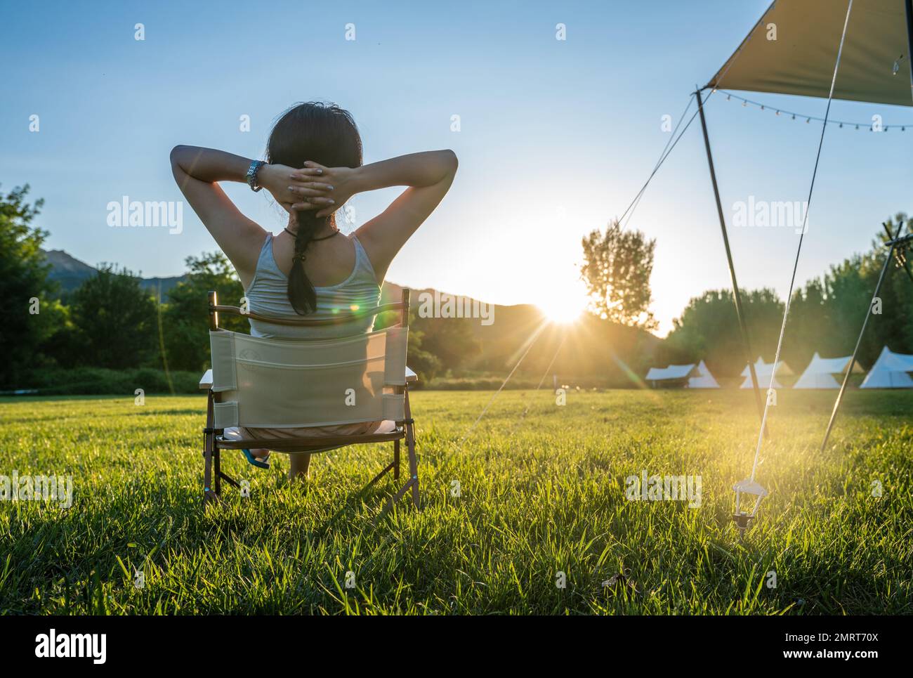 Sunshine girl sit chair Stock Photo - Alamy